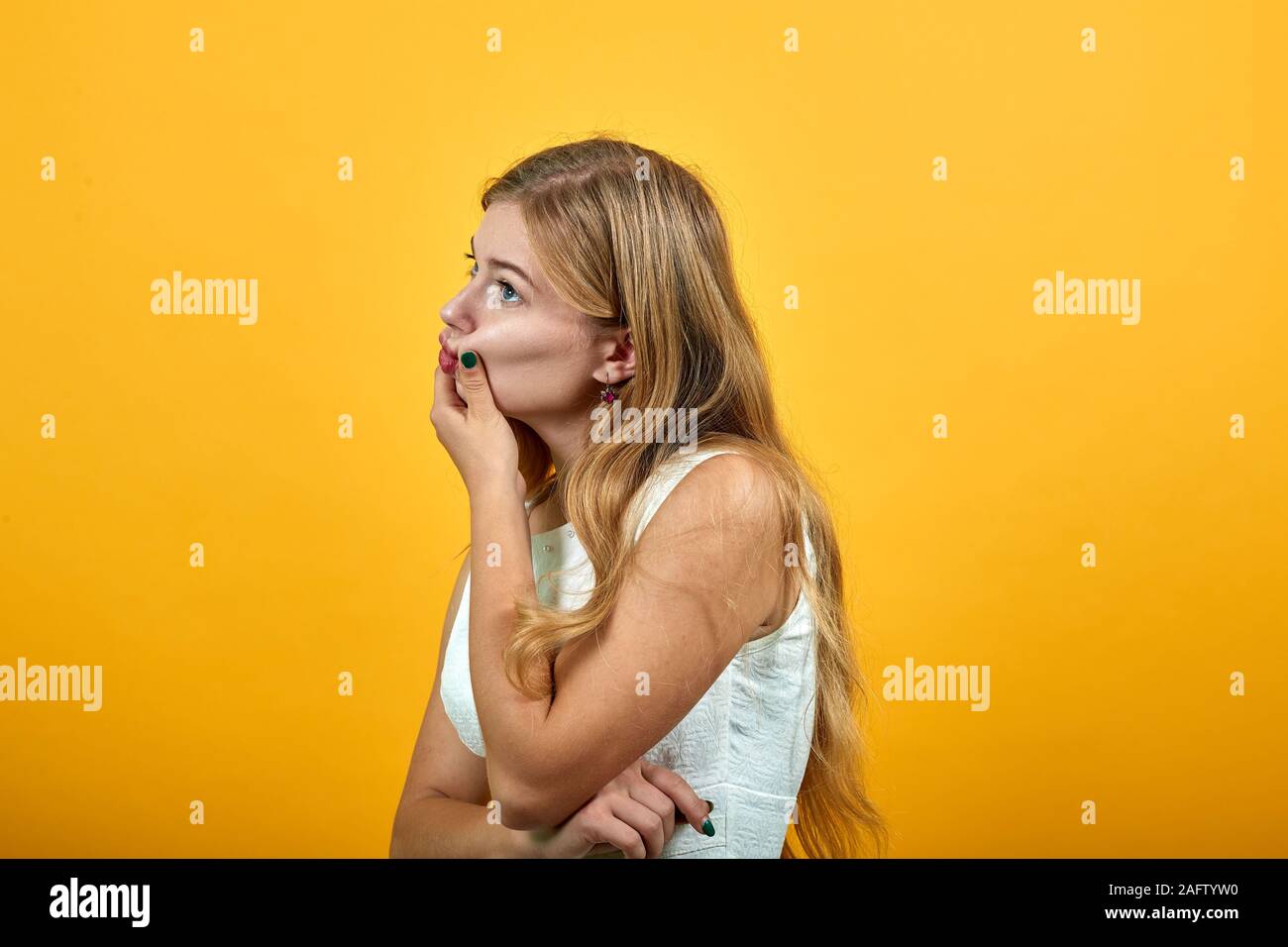 Finger on cheeks hi-res stock photography and images - Alamy