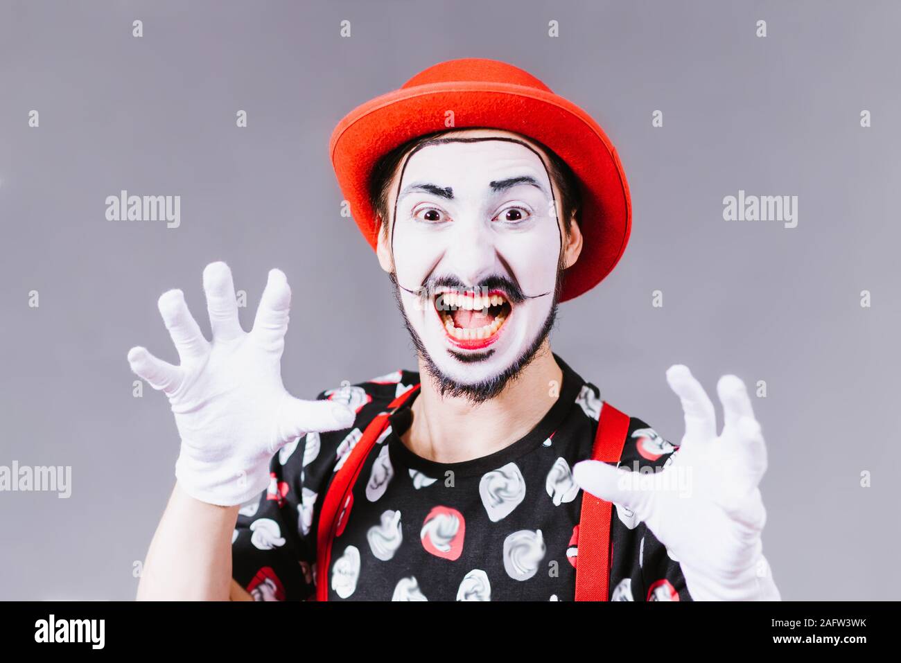 Mime poses and grimaces in the studio Stock Photo - Alamy