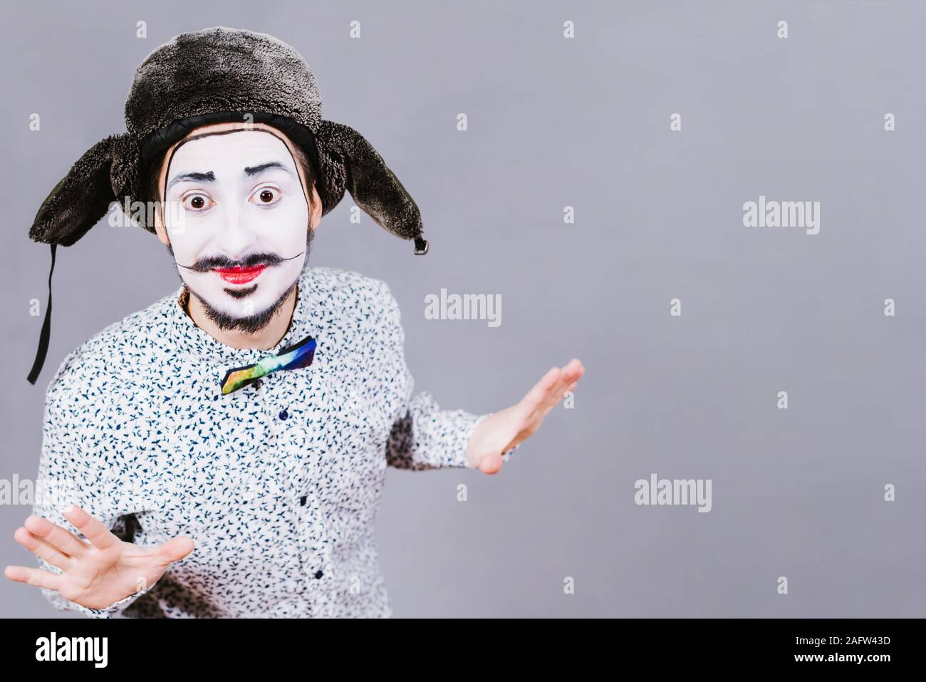 Mime poses and grimaces in the studio Stock Photo - Alamy