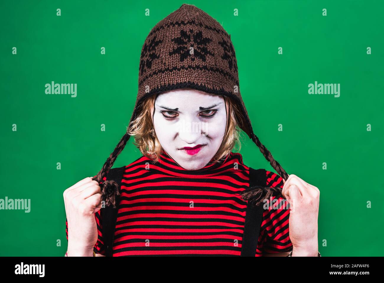 cheerful mime girl posing and grimacing in photo studio Stock Photo - Alamy