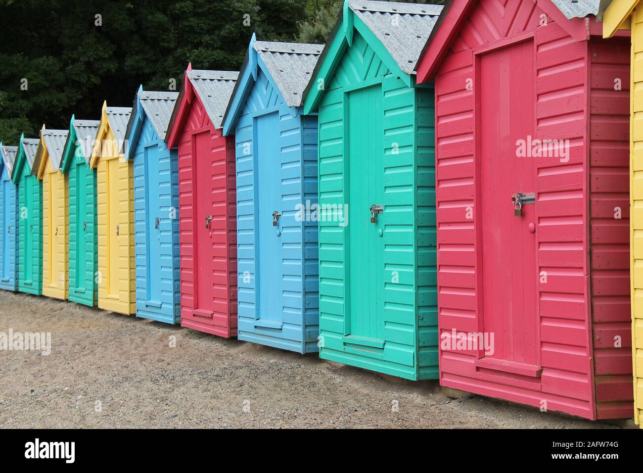 A Collection of Wooden Beach Huts at the Seaside Stock Photo - Alamy