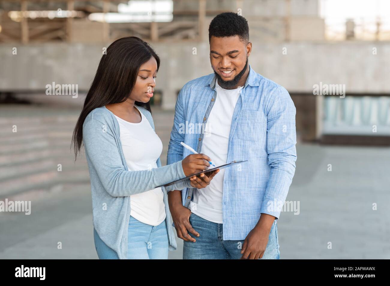 Female interviewer making survey hi-res stock photography and images ...
