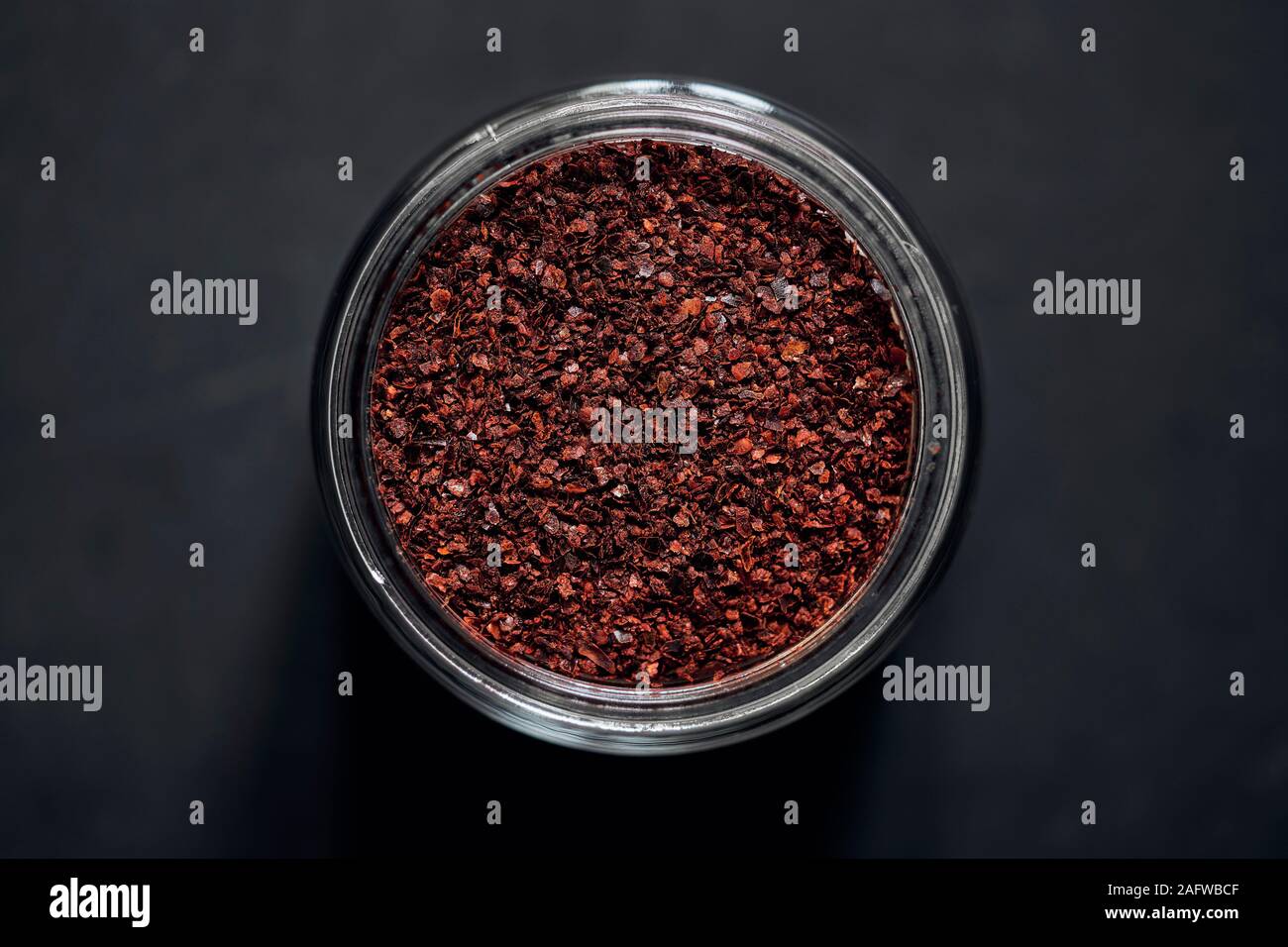 View from above Korean chili pepper flakes in spice jar Stock Photo - Alamy