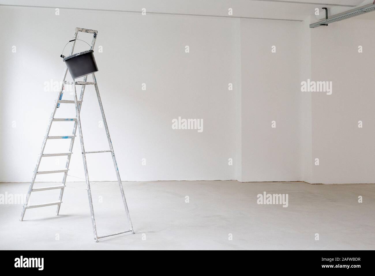 Ladder in empty room at construction site Stock Photo - Alamy