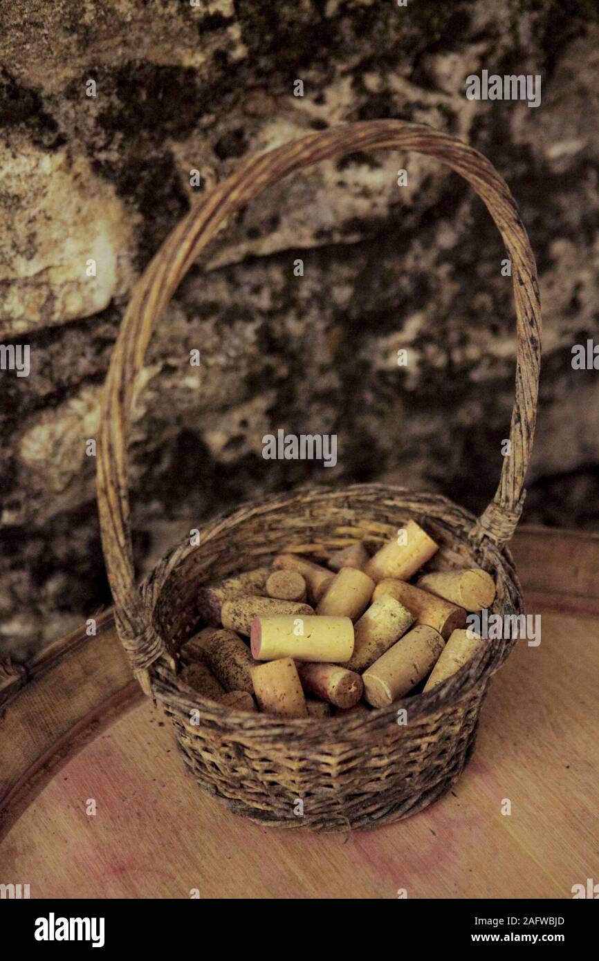 Wine corks in rustic basket on keg Stock Photo - Alamy