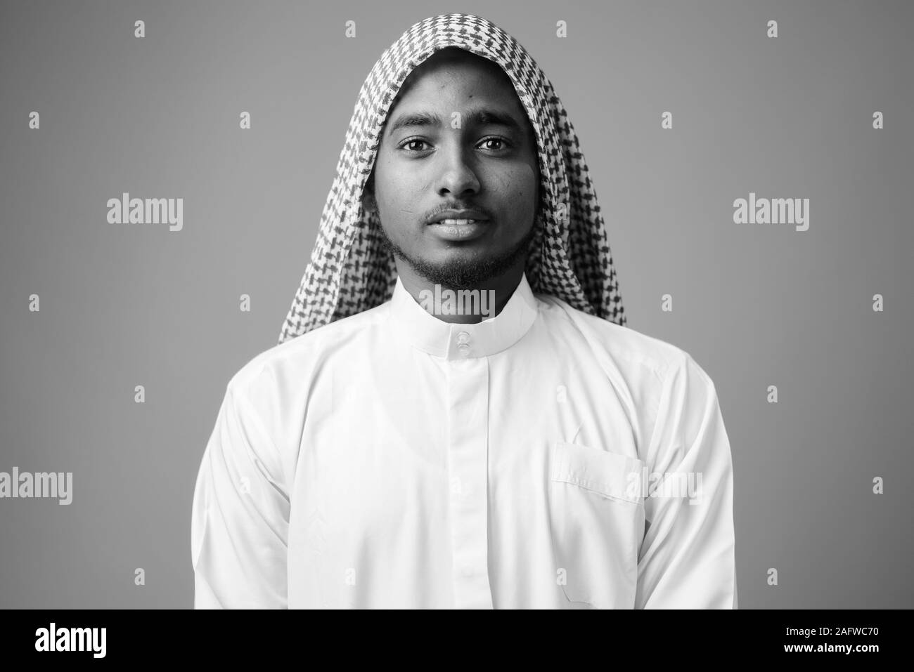 Young handsome African man wearing traditional Muslim clothes Stock ...