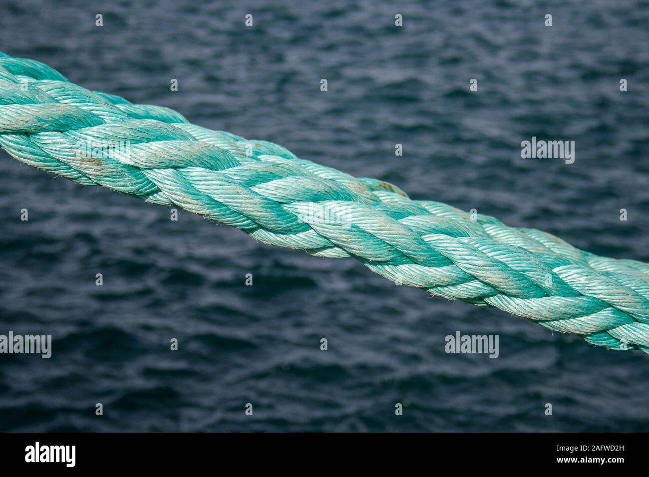 Blue rope and water Stock Photo - Alamy