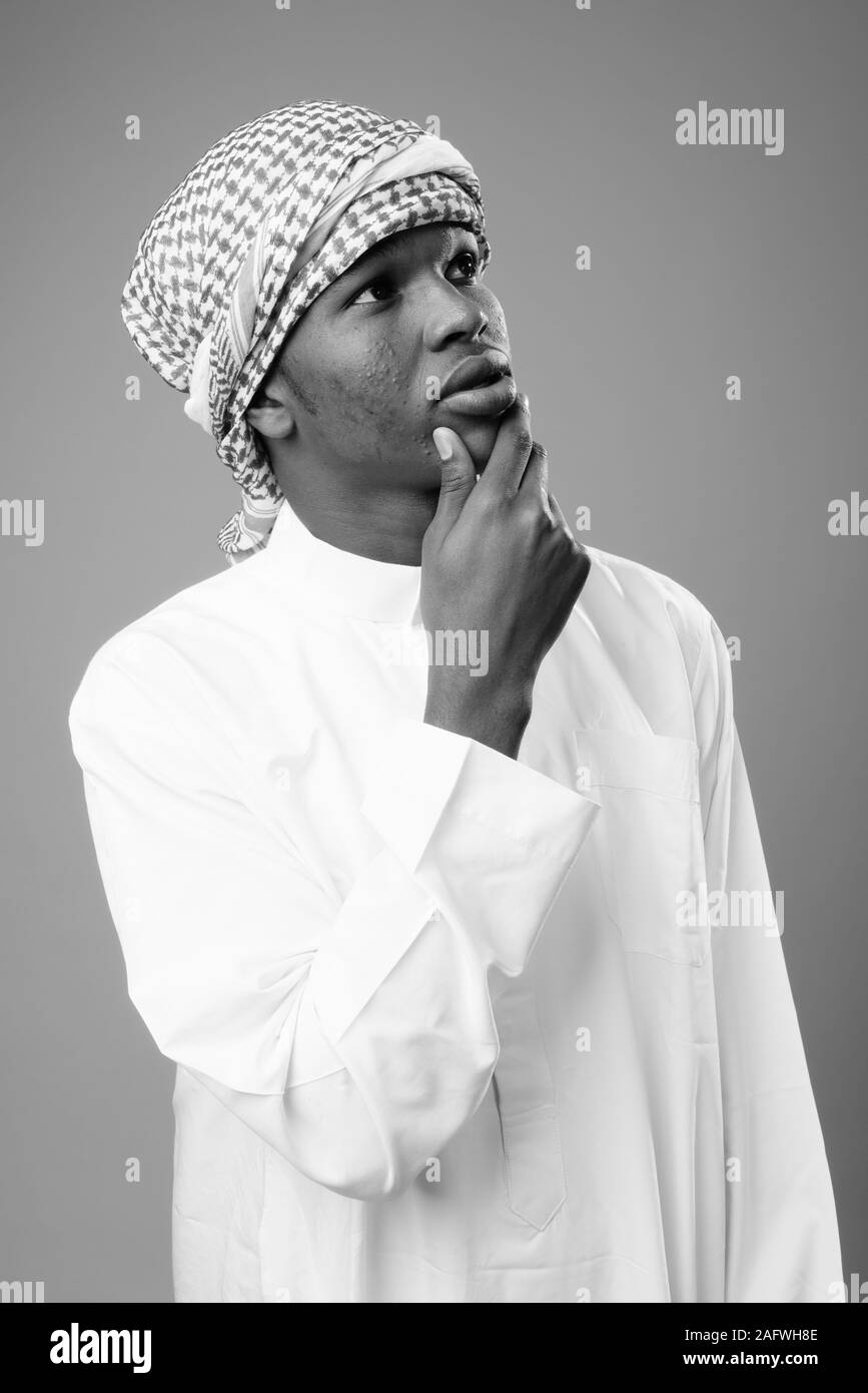 Young African man wearing traditional Muslim clothes Stock Photo - Alamy