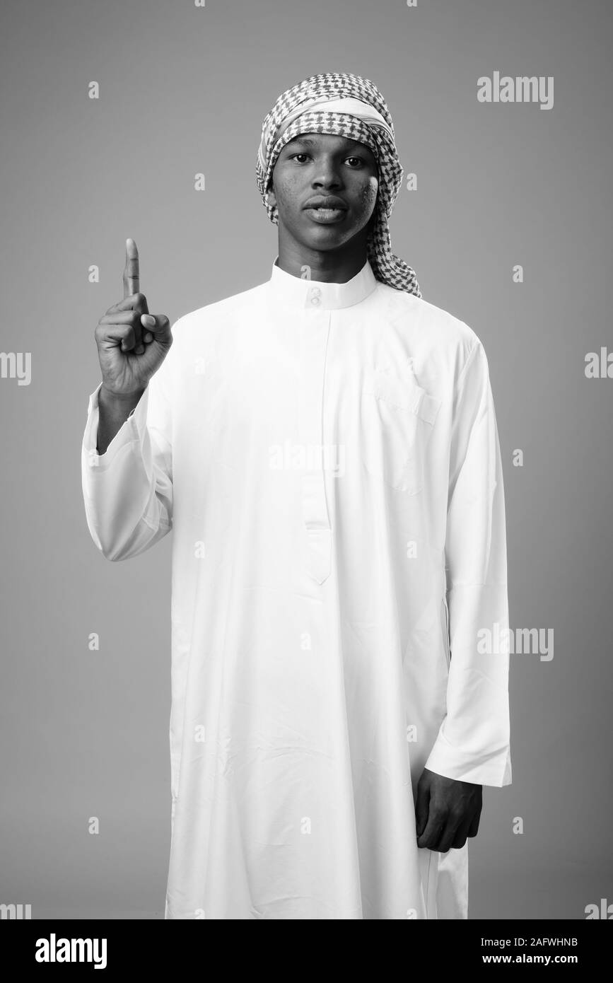 Young African man wearing traditional Muslim clothes Stock Photo - Alamy