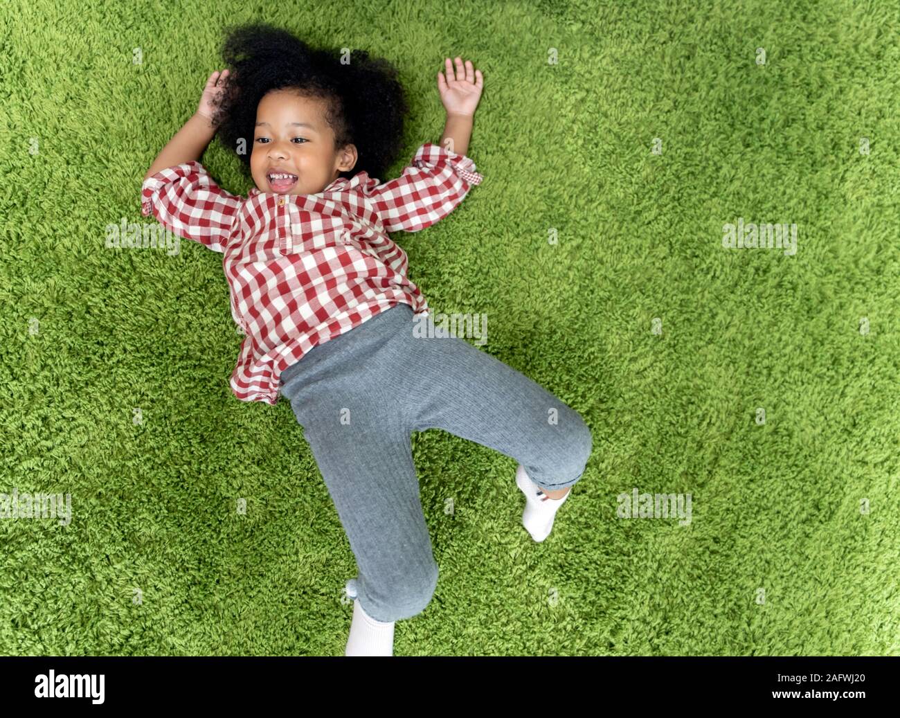 Group happy kids laying in hi-res stock photography and images - Alamy
