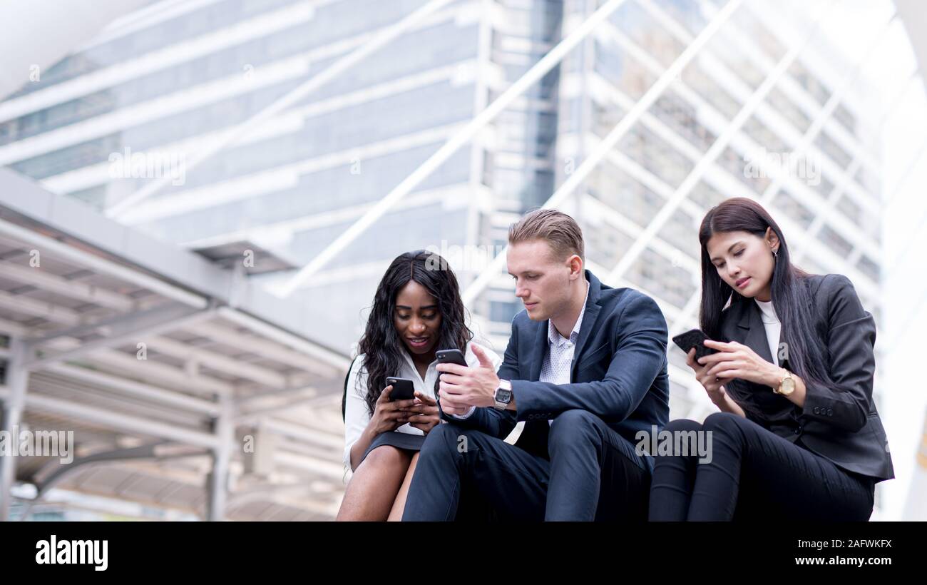 Business people using smart phone in urban city Stock Photo - Alamy