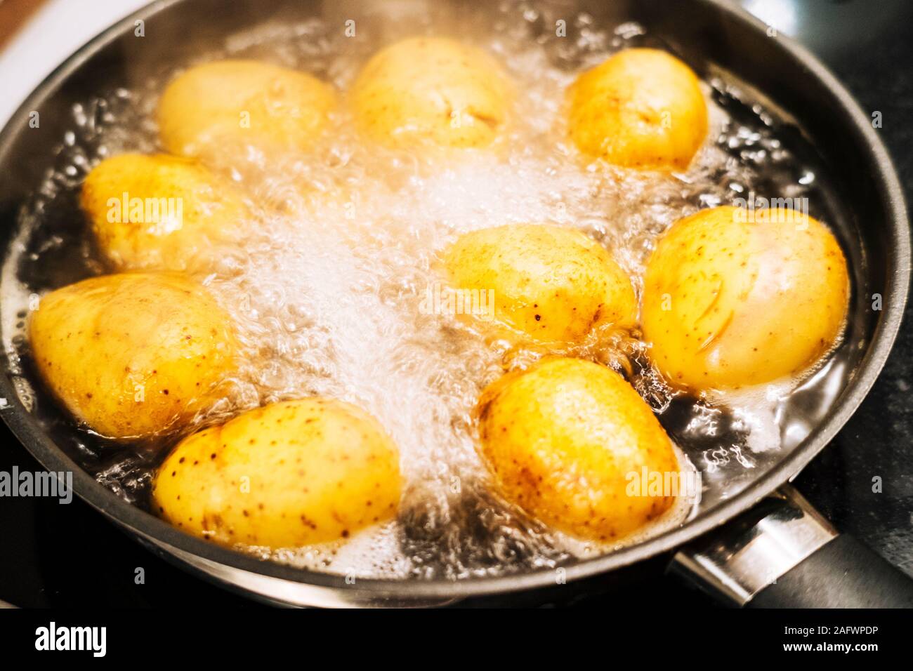 Boiling potatoes hi-res stock photography and images - Alamy