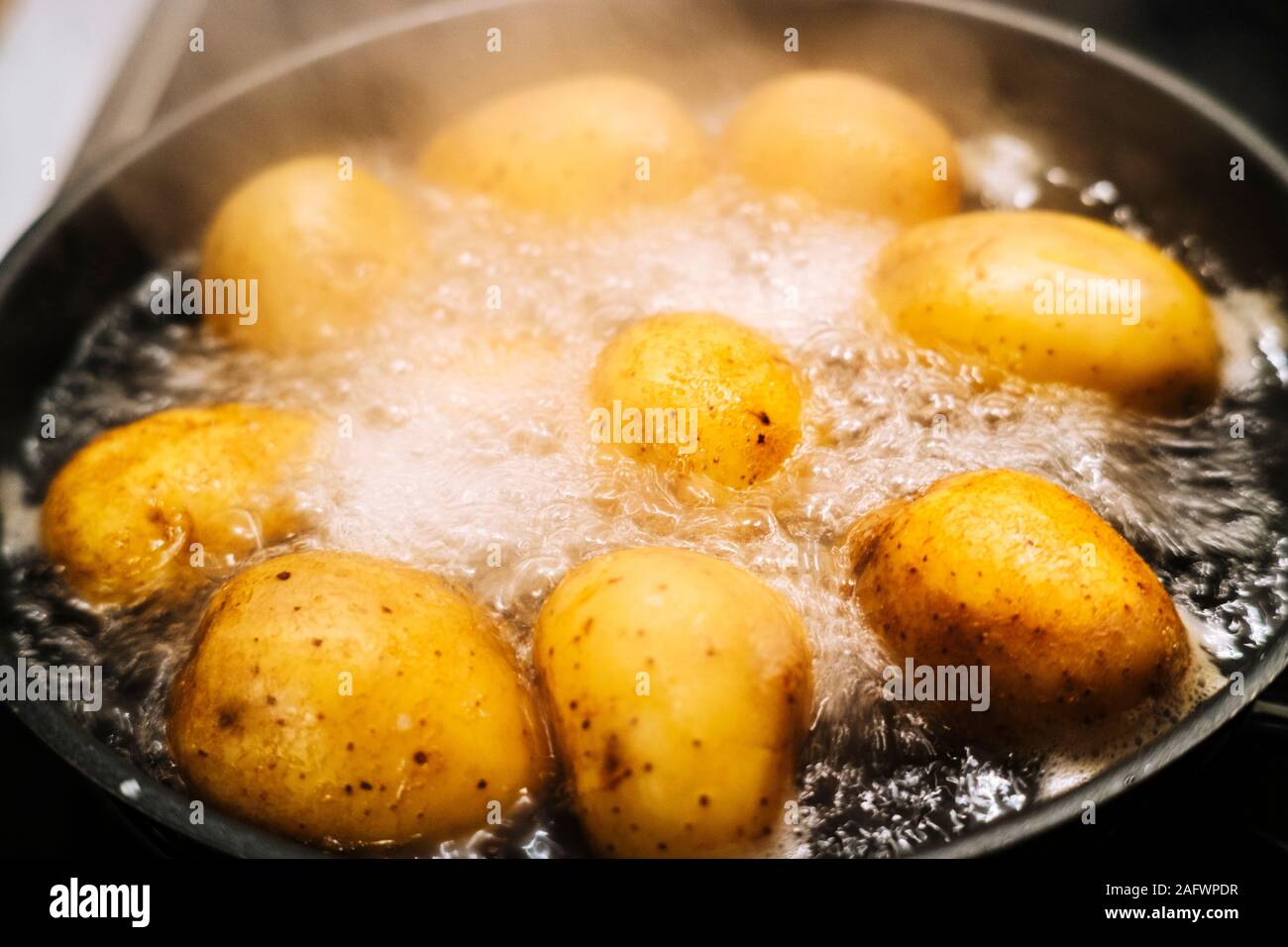 Hot boiling potatoes hi-res stock photography and images - Alamy