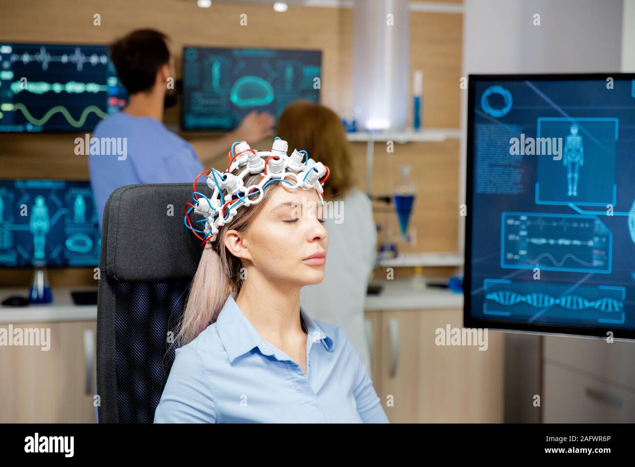 Female patient scanning her brain with neurology headset. Brain ...