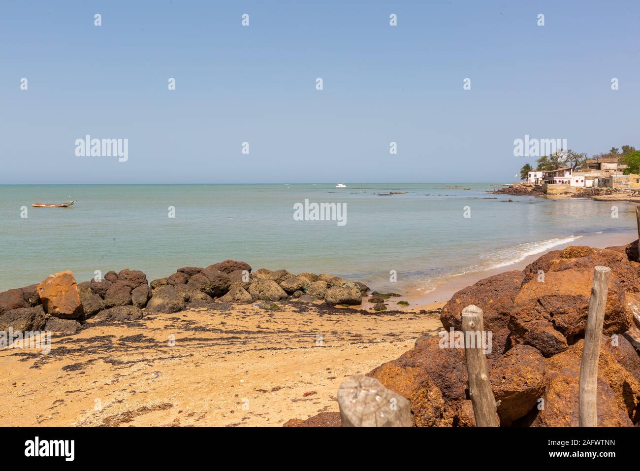 Beautiful beach and the calm ocean under the blue sky captured in ...