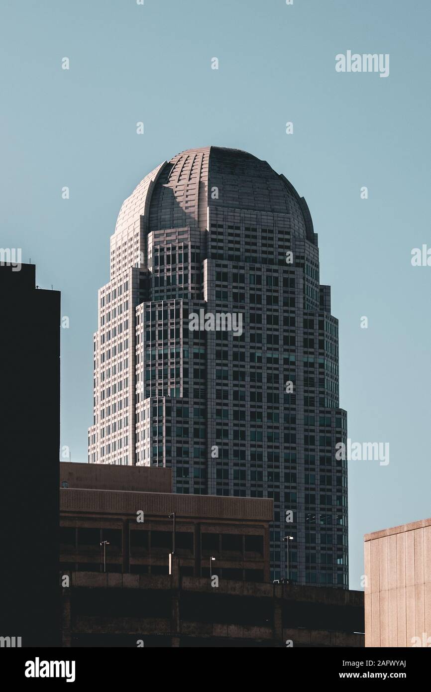Vertical shot of a modern high rise business building touching the sky ...