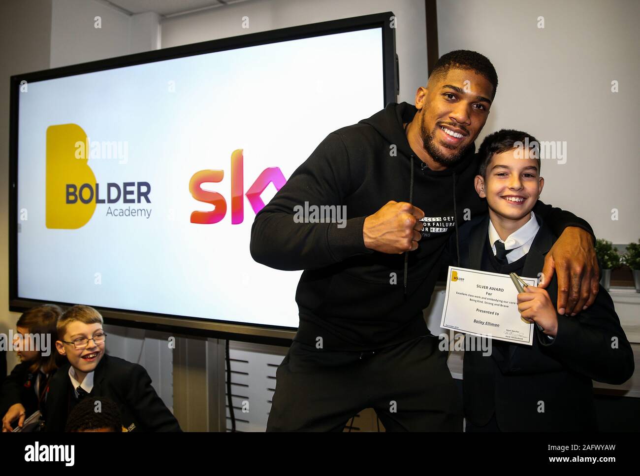 Anthony Joshua poses for a photo with Sliver Award winner Bailey ...