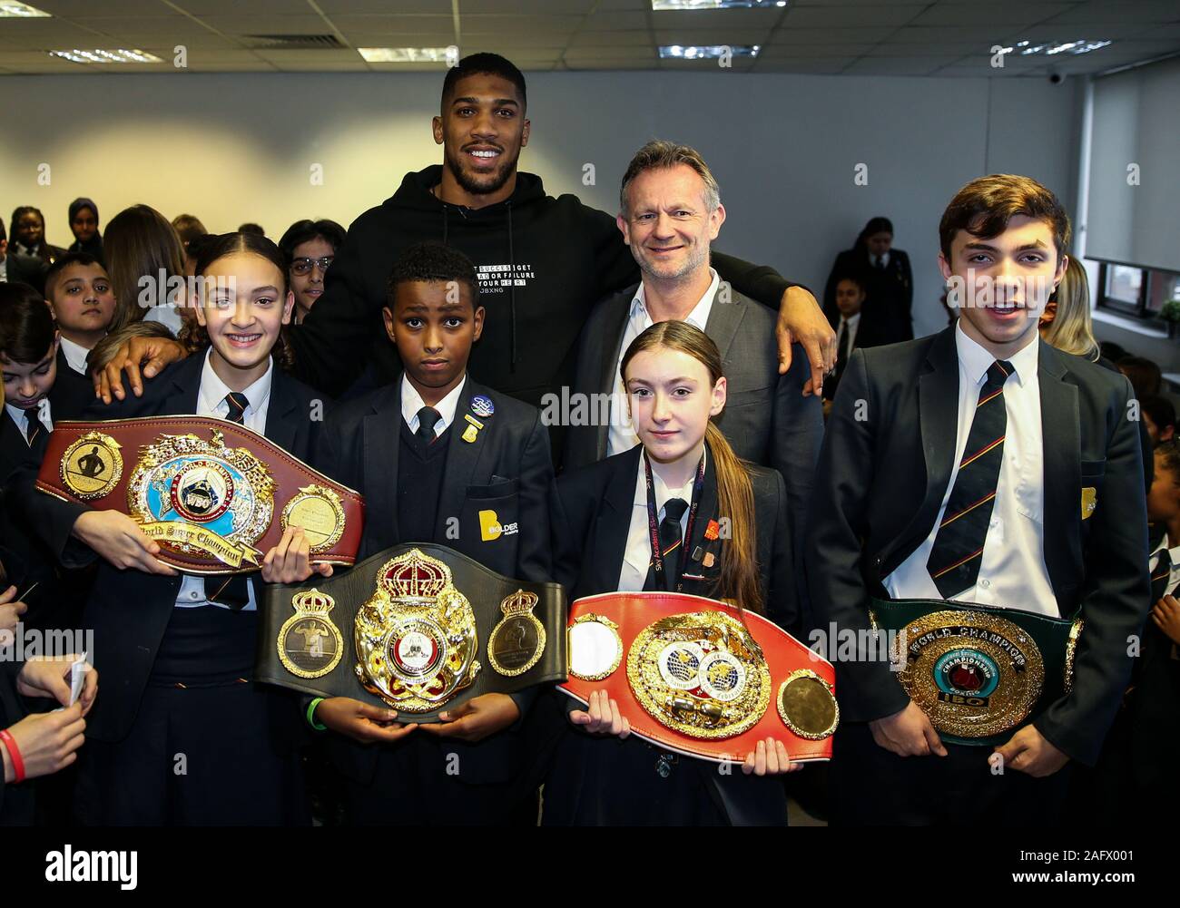 Anthony Joshua poses for a photo with Sky Sports managing director Rob ...