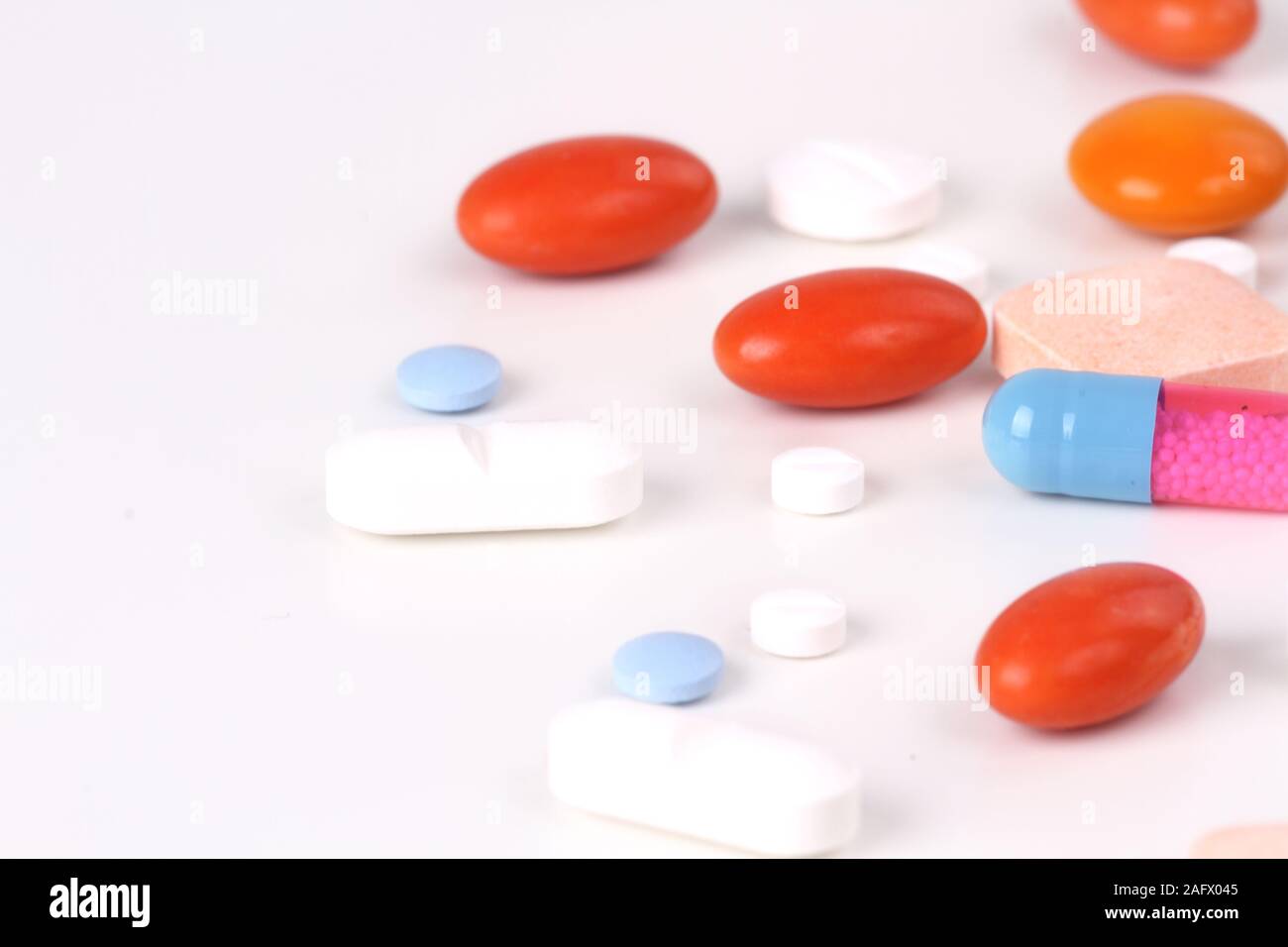 Drugs and medicines - different color pills on white background Stock ...