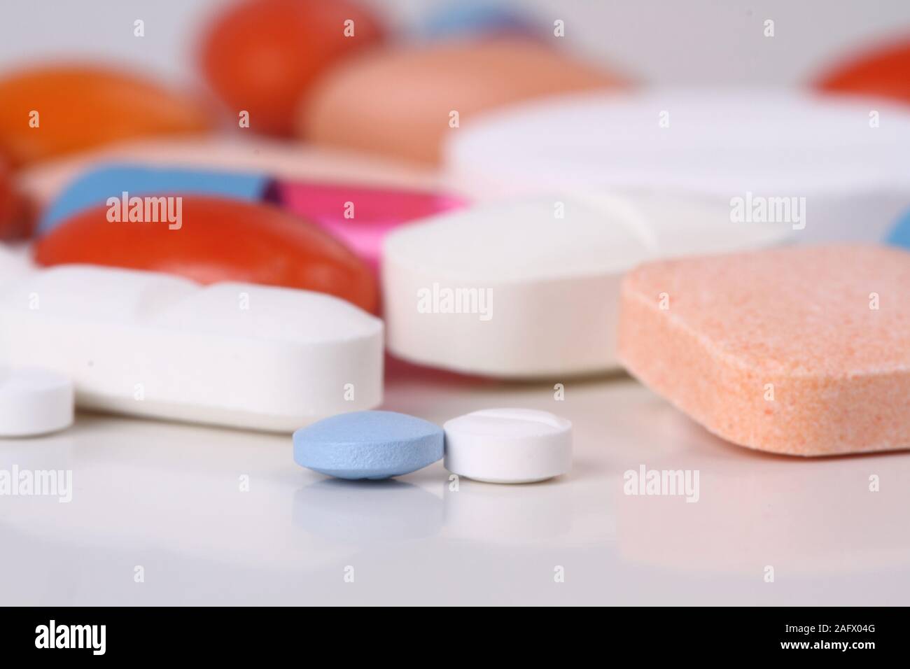 Drugs and medicines - different color pills on white background Stock ...