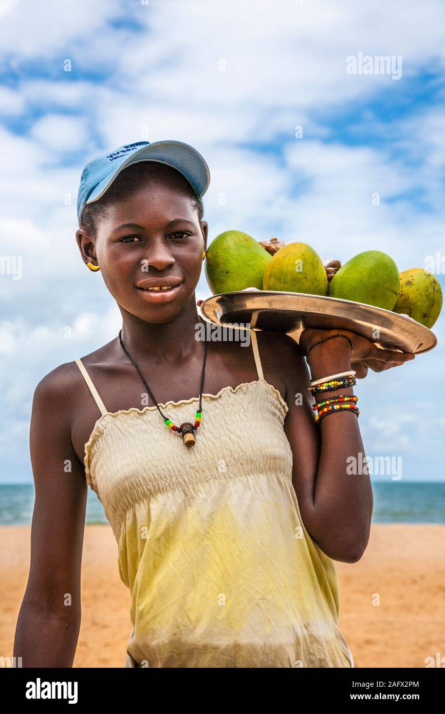 Woman fruit seller beach west africa hi-res stock photography and ...
