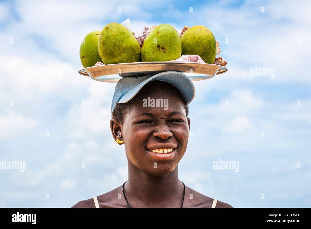 Woman fruit seller beach west africa hi-res stock photography and ...