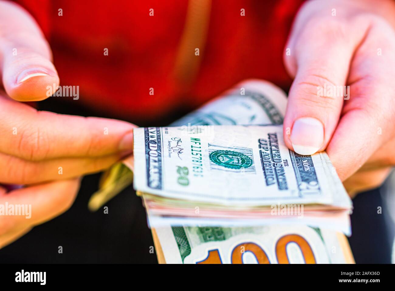 Woman counting money, counting dollars close up Stock Photo - Alamy