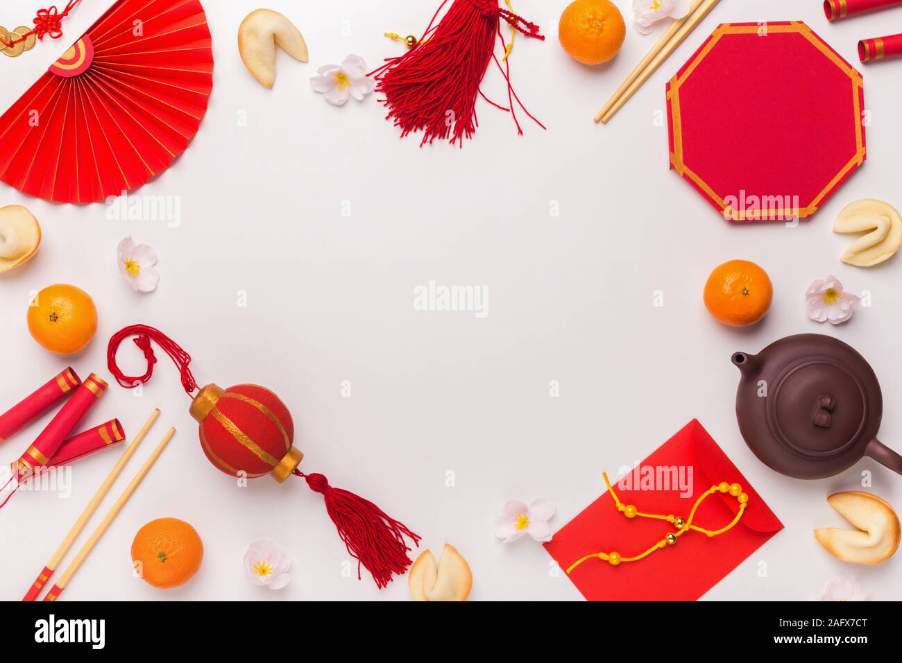 Chinese New Year decorations creating frame on white Stock Photo - Alamy