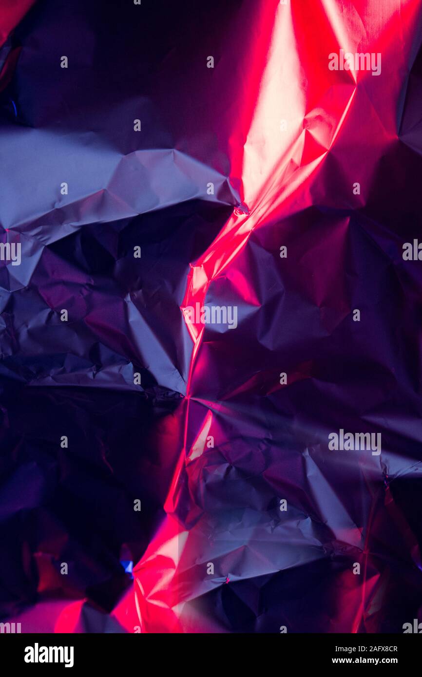 Crumpled red-blue paper with textured surface.Texture or background ...