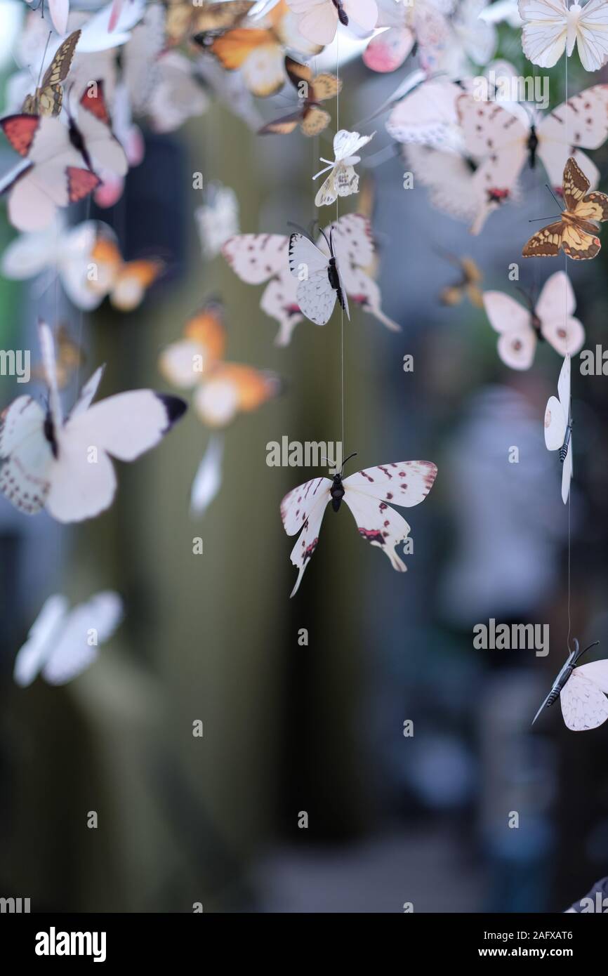 Festive decoration in the form of butterflies made of paper, suspended ...