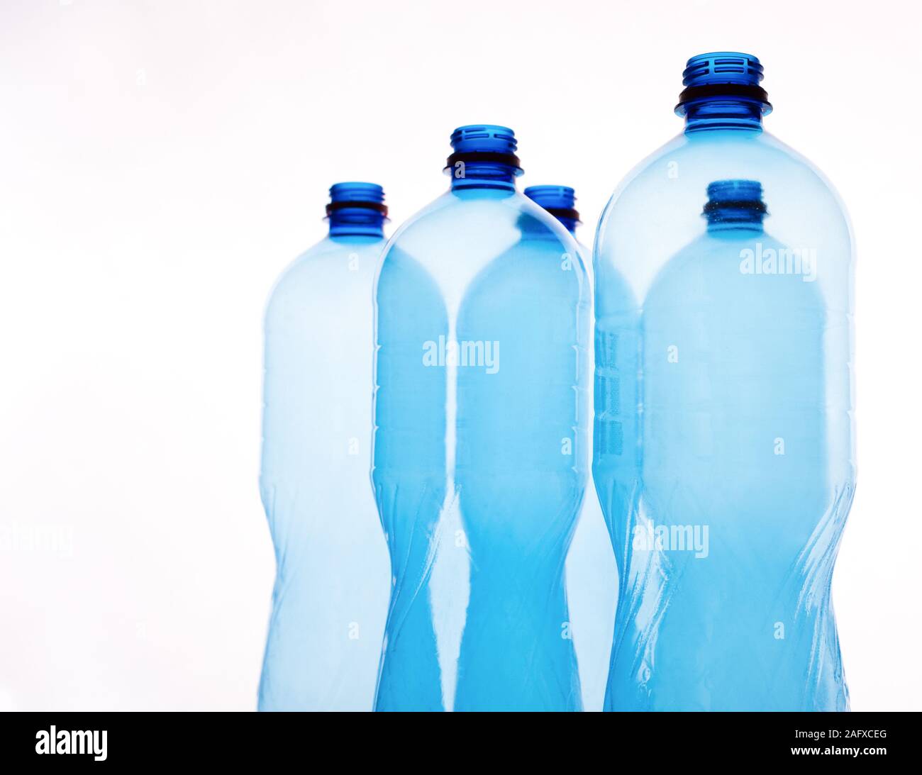 Empty plastic bottles isolated on white background Stock Photo - Alamy