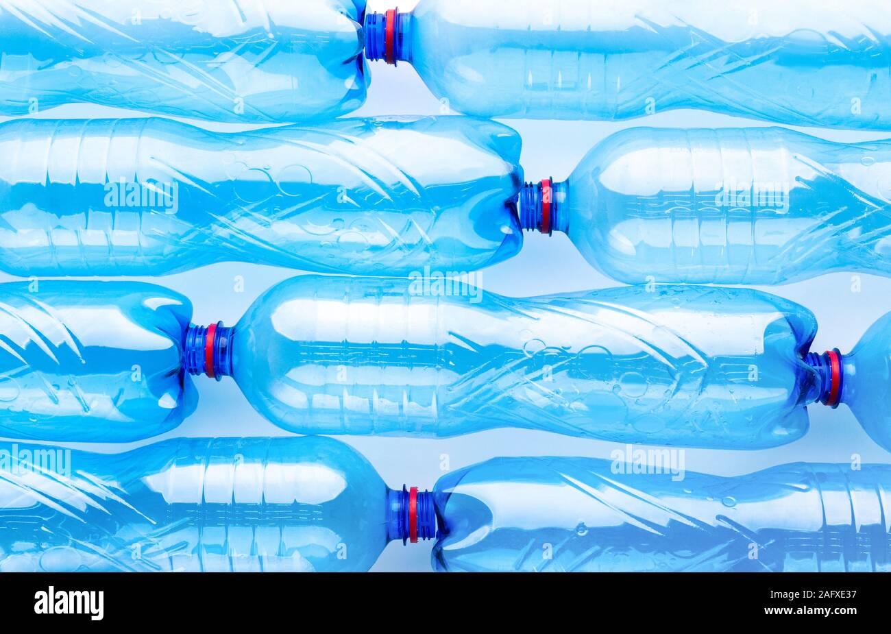 Creative composition of plastic bottles pattern on white Stock Photo ...