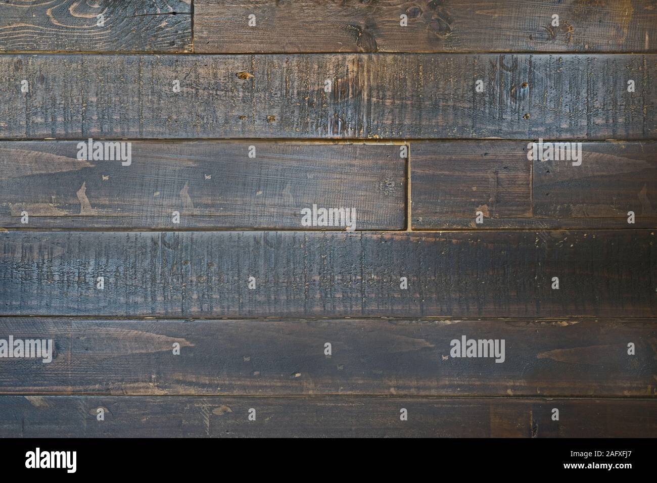 Charred Board facade of an old house with a textured surface .Texture ...