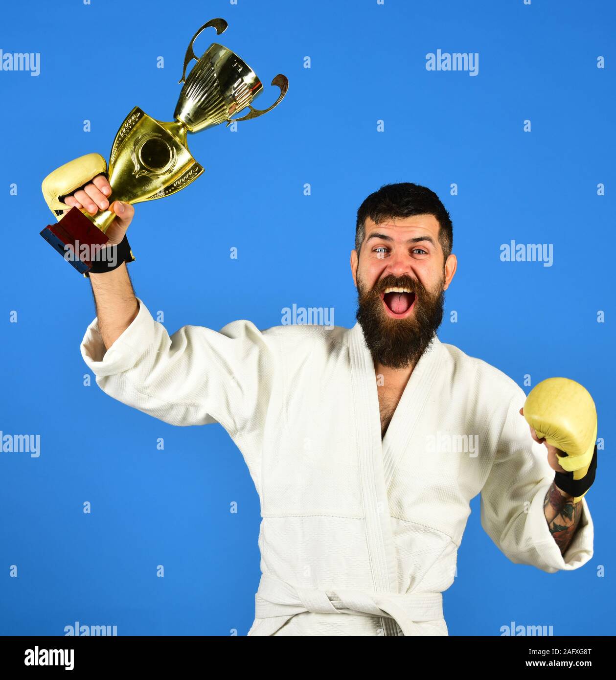 Japanese martial arts concept. Man with beard in white kimono on blue ...