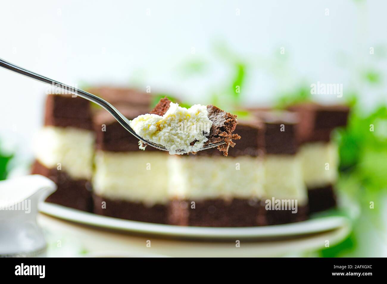 cake on a fork in the background more cakes Stock Photo - Alamy