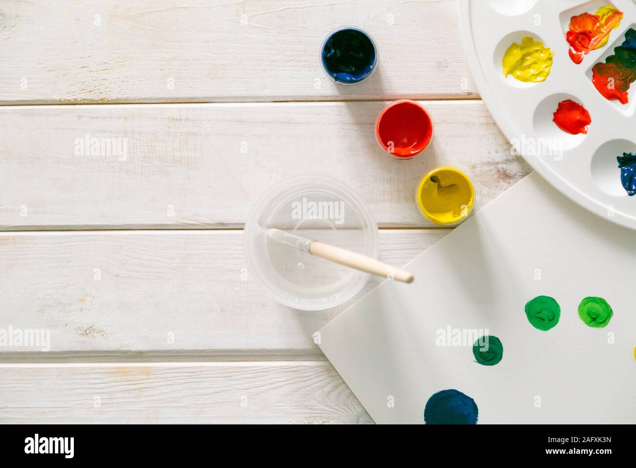 Art concept - colour wheel, gouache paints, brush and palette Stock ...