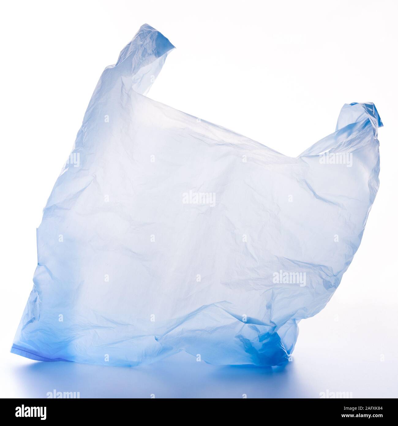 Empty blue polyethylene bag on white background Stock Photo - Alamy
