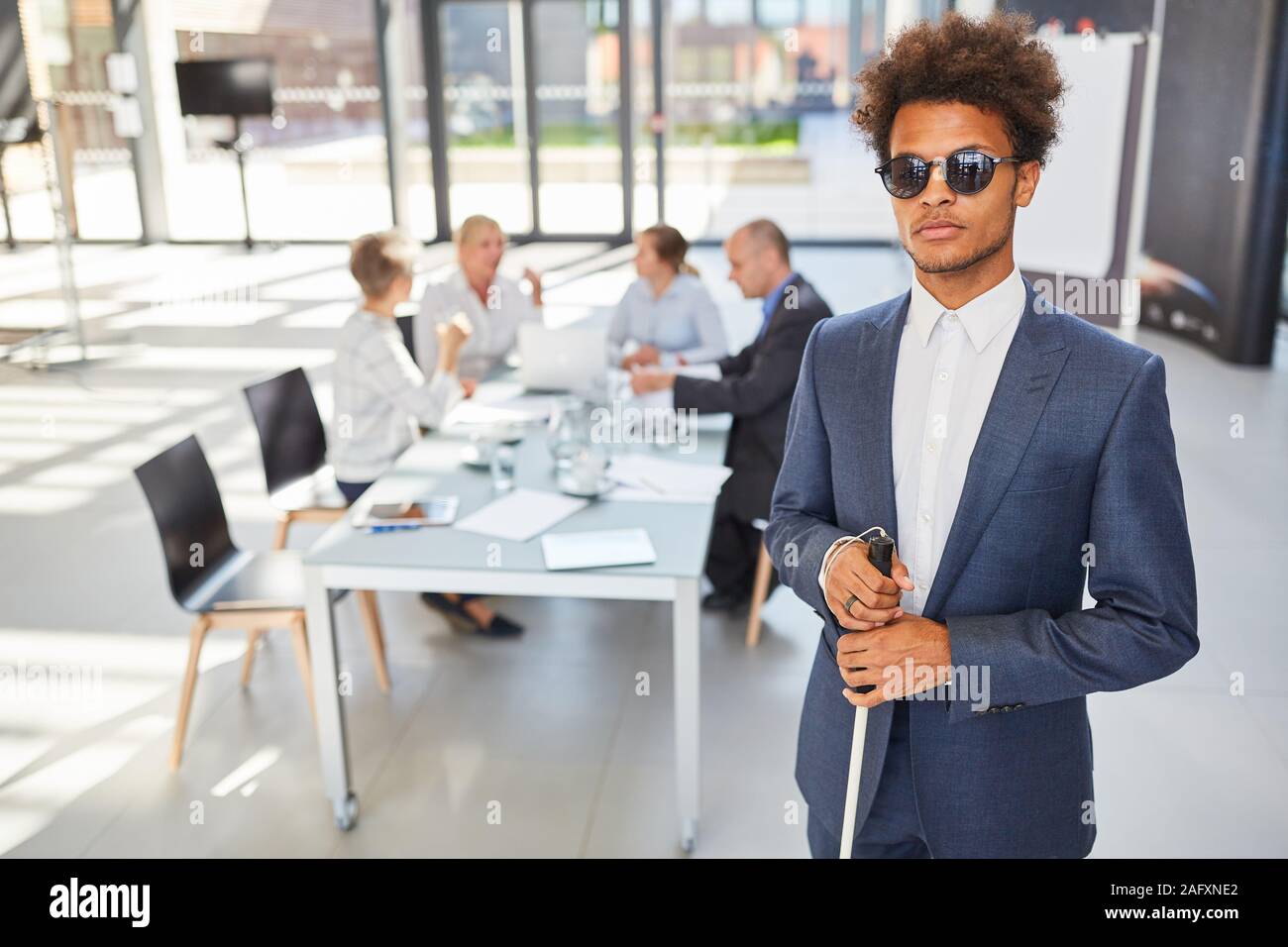 Blind african businessman in business office for inclusion concept ...