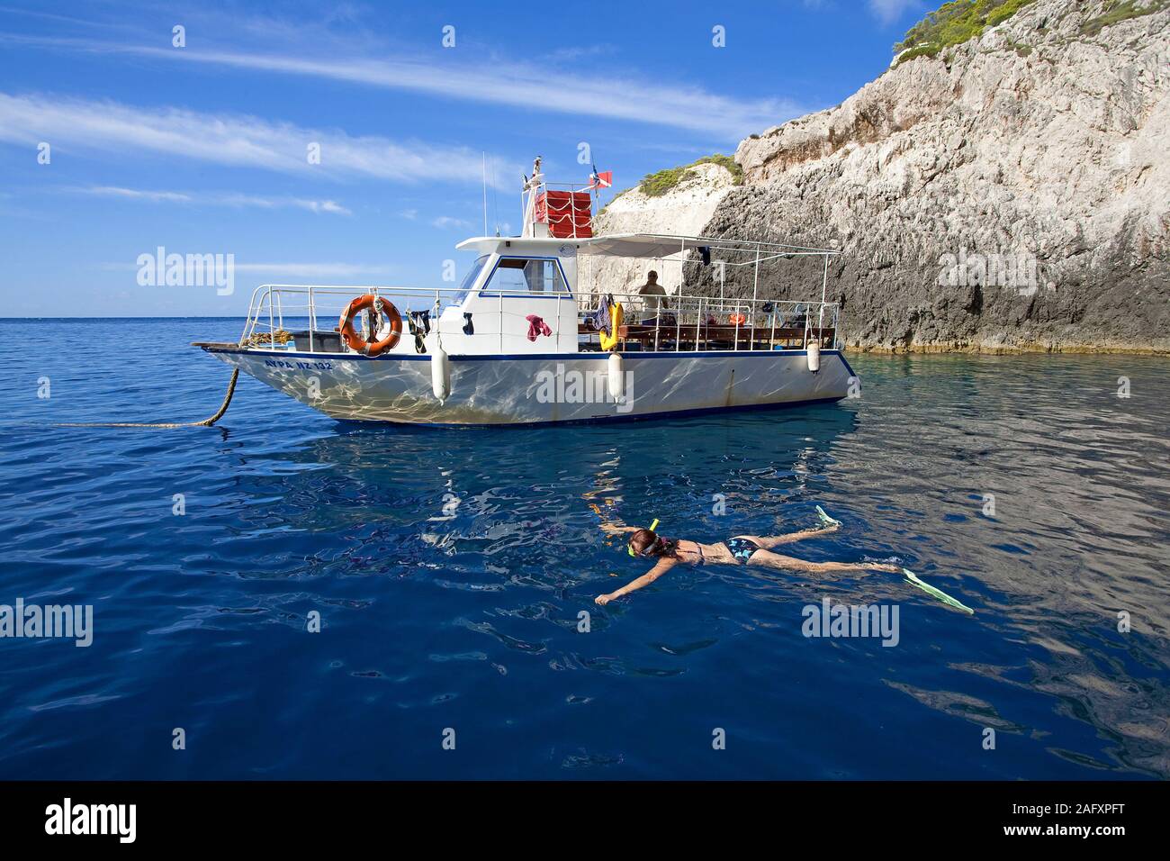 Woman boat greece bikini hi-res stock photography and images - Alamy