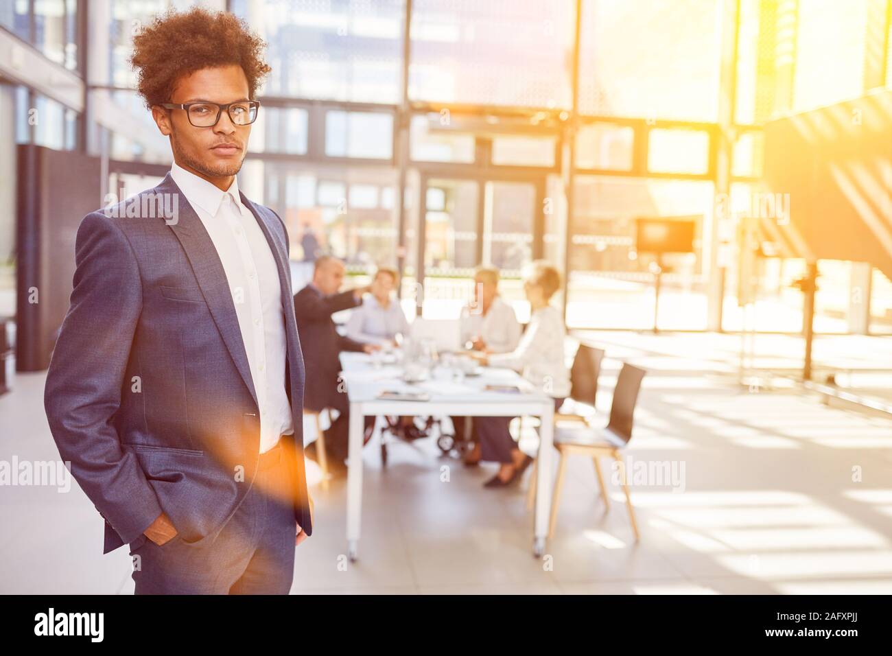 African businessman as a start-up entrepreneur in front of business ...