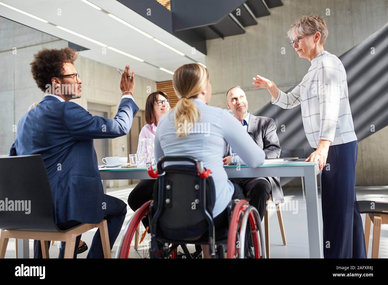 Business team having a discussion in a meeting for inclusion and ...