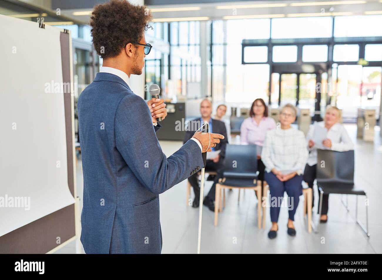 Blind businessman as a speaker at a conference or training Stock Photo ...