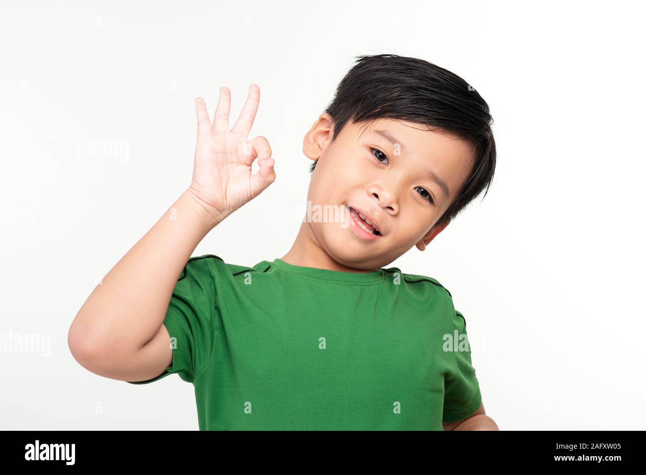 Little cute boy showing OK sign and smiling, isolated on white ...