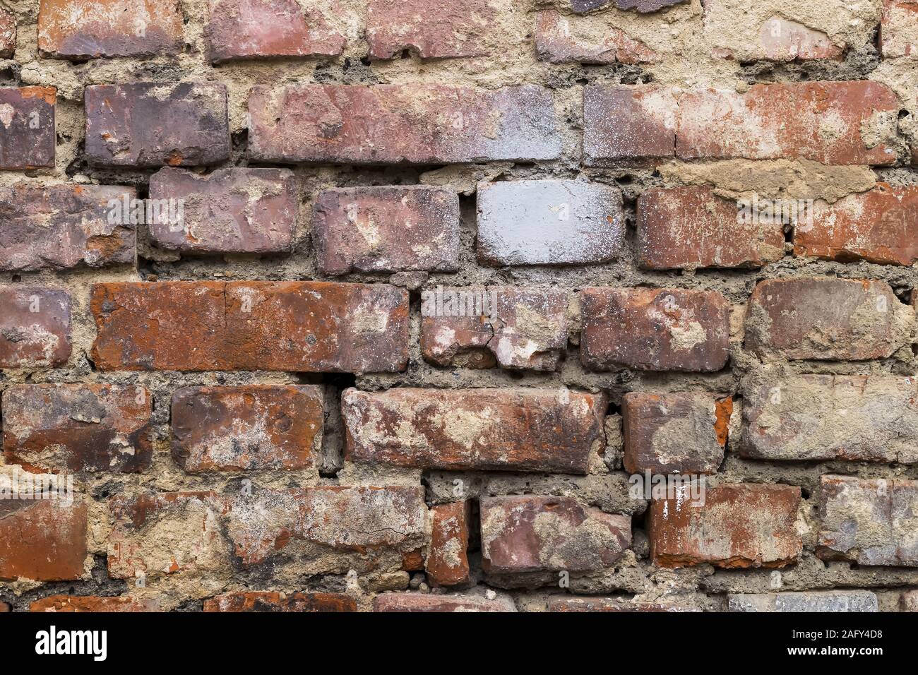 Background of old red stone wall. Texture of brick Stock Photo - Alamy