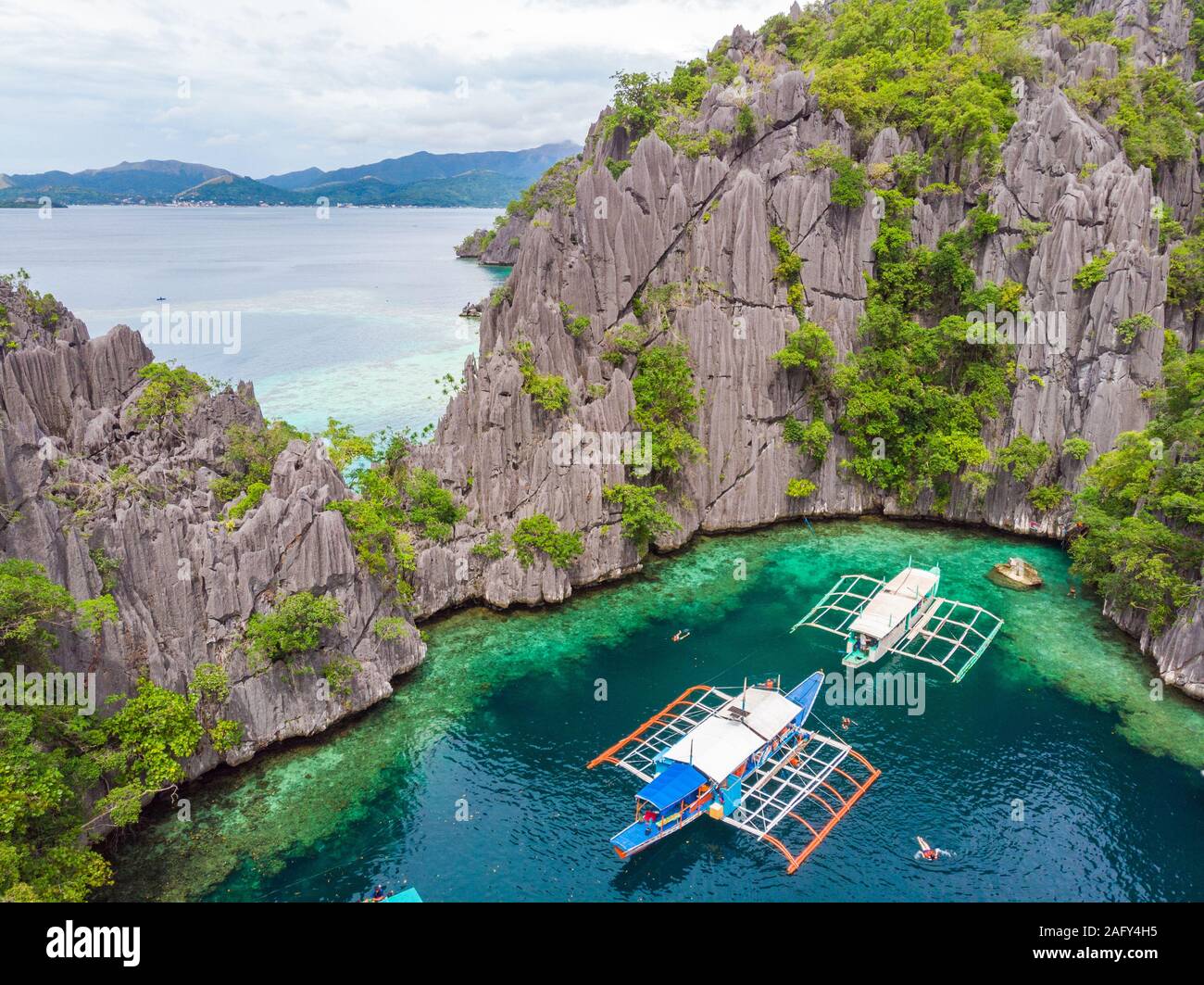 Aerial view of Twin Lagoon on paradise island with sharp limestone ...