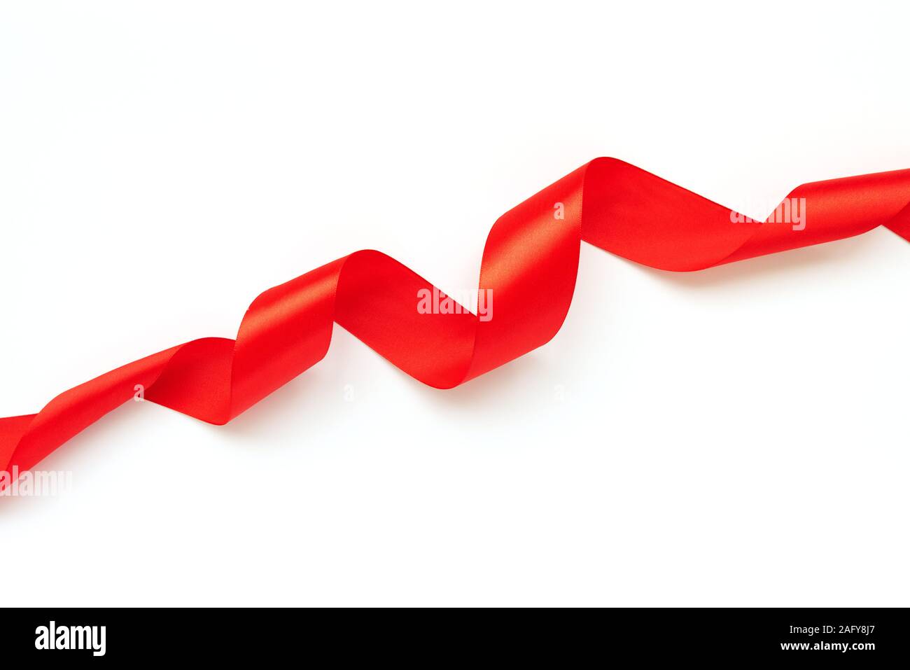 Red curly ribbon isolated on white background. Valentines day or ...