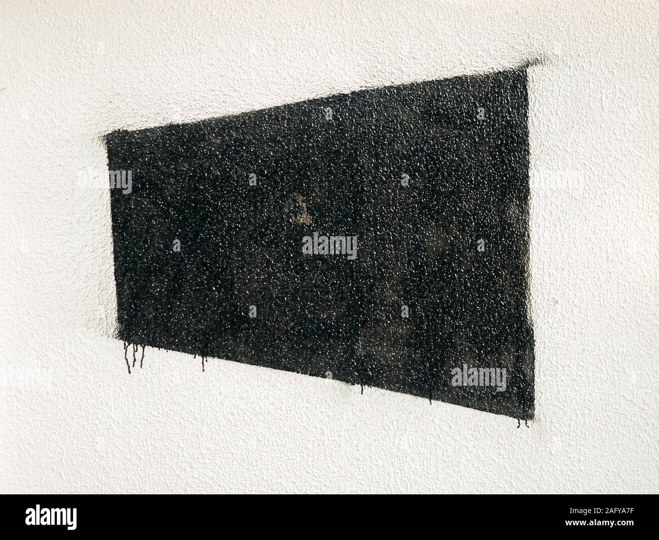 The black rectangle is painted on wall of the fence Stock Photo - Alamy