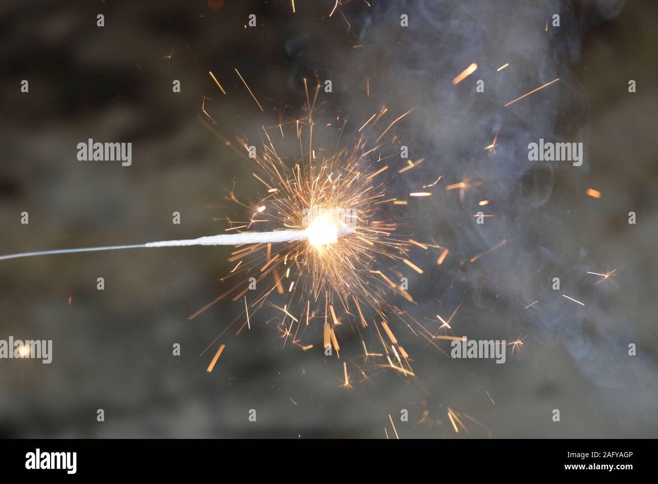 Small fireworks are lit at the new year's event Stock Photo - Alamy