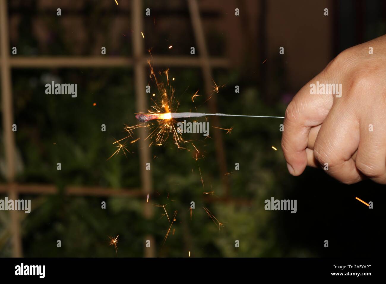 Small fireworks are lit at the new year's event Stock Photo - Alamy