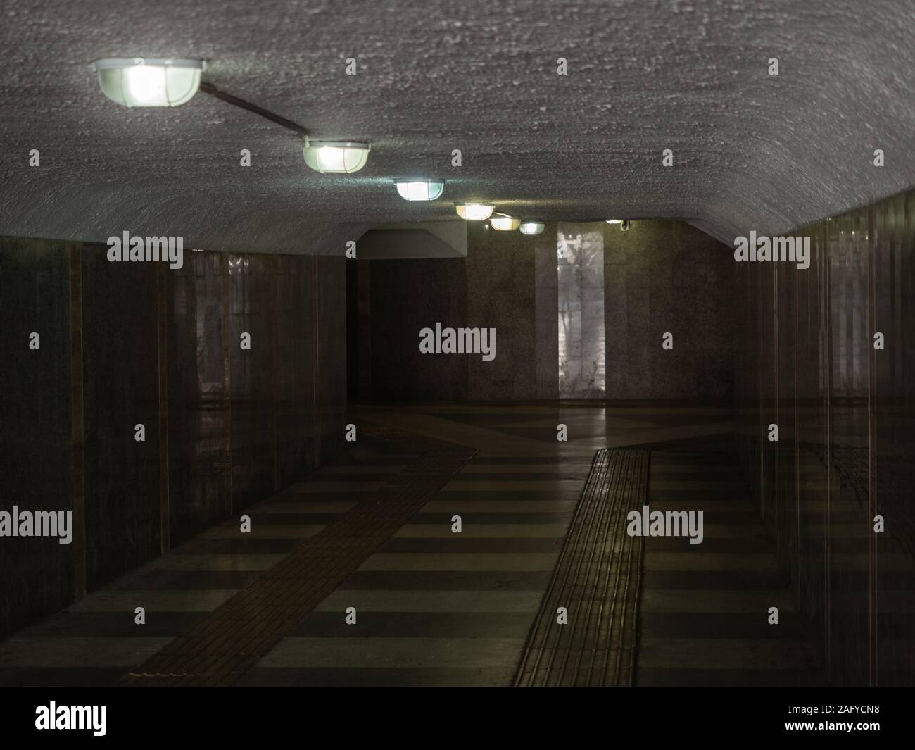 A row of fixtures on the ceiling in tunnel Stock Photo - Alamy